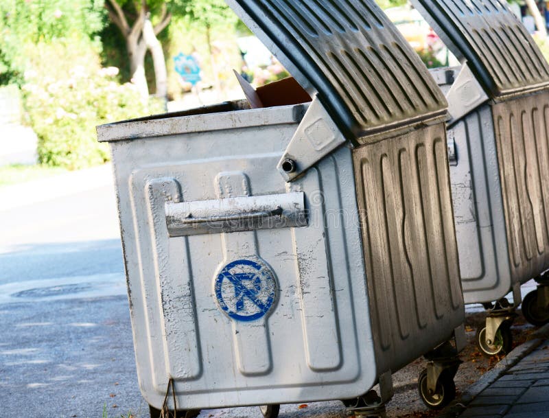 Waste Containers of Silver Color on a City Street Stock Photo - Image ...