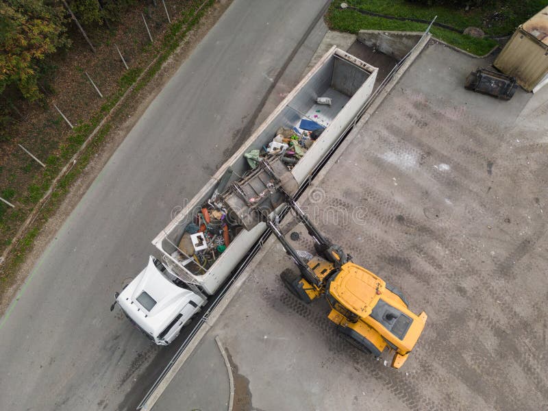 Waste Loading Operation, Loader Dumping Trash in a Truck Stock Image ...