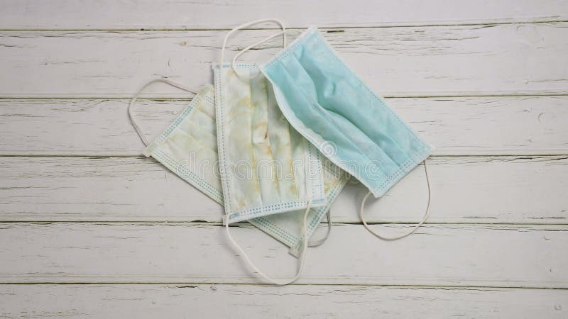 Waste of Mask Disposable Objects on Wooden Background Stock Image ...