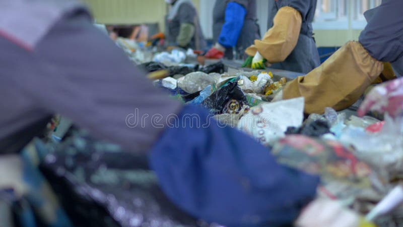 Waste Recycling Plant. Workers Hands Sorting Garbage for Recycling ...