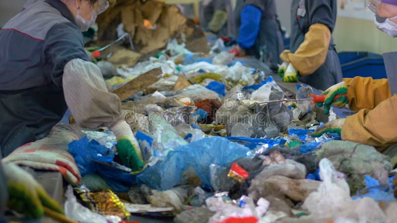Waste Recycling Plant. Workers Hands Sorting Garbage for Recycling ...