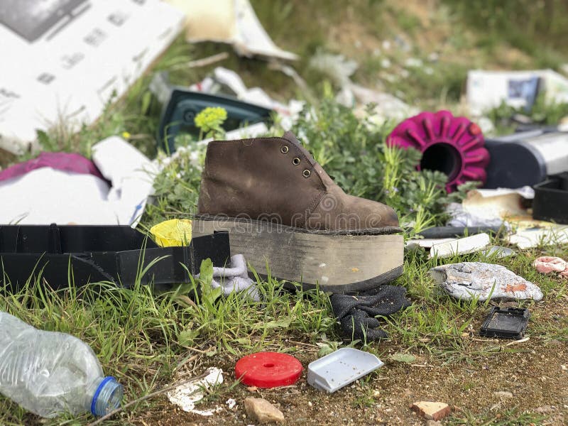 Waste scattered on grass stock image. Image of impairment - 142003387