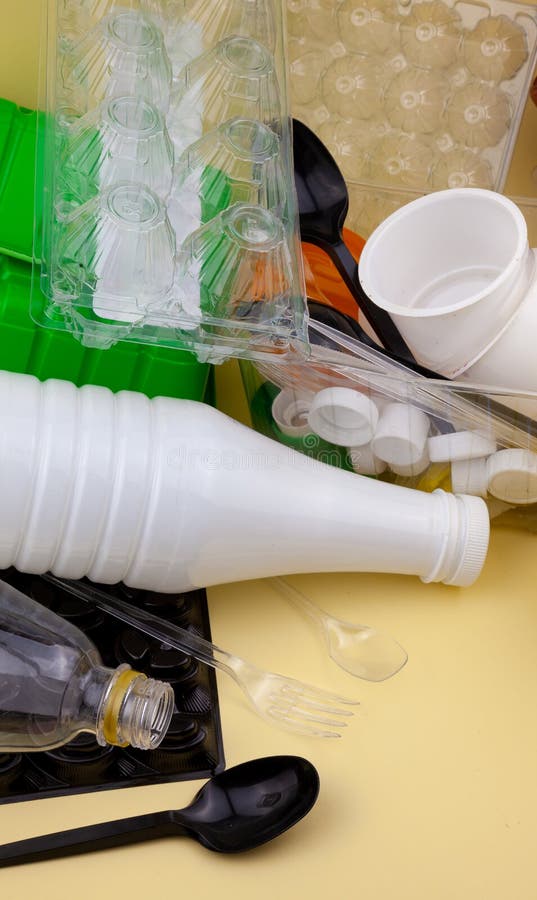 Sorting of Plastic Bottles and Containers in Colorful Recycling Bins ...