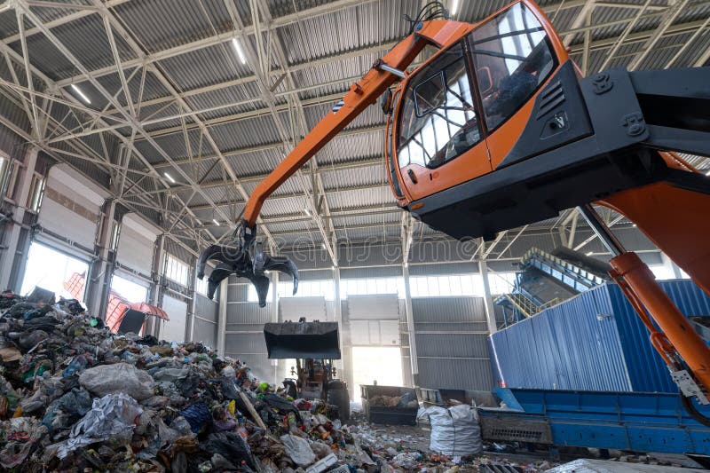 Waste Sorting and Recycling Plant. Loader and Grab Crane are Handling ... Waste Sorting and Recycling Plant. Loader and Grab Crane are Handling ...