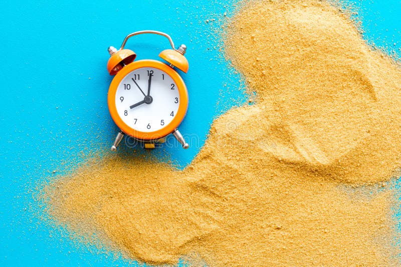 Waste of Time Concept. Clock Near Sand on Blue Background Top-down Copy ...