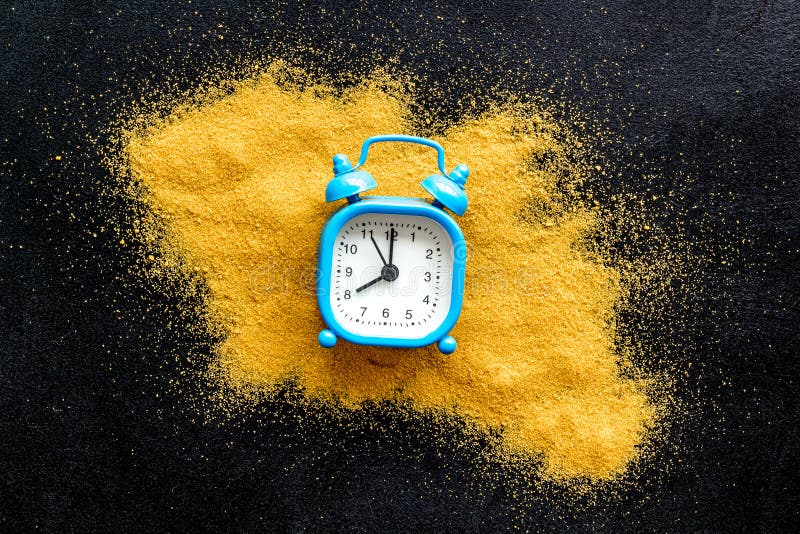 Waste of Time Concept. Clock on Sand on Blue Background Top-down Stock ...