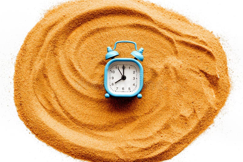 Waste of Time Concept. Clock on Sand on Blue Background Top-down Stock ...