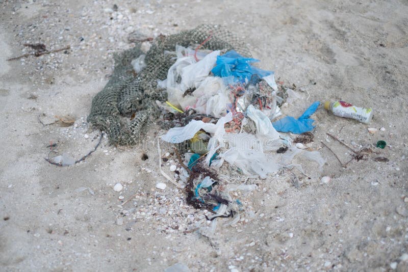 Waste Trash Pollution on Beach with Plastic Bag, Net, and Bottle ...
