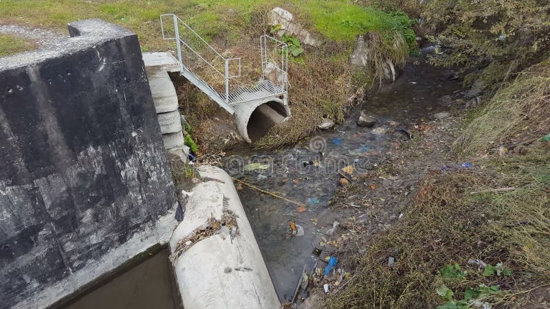 Waste Water, Pollution and Garbage in Urban Canal. Stock Footage ...