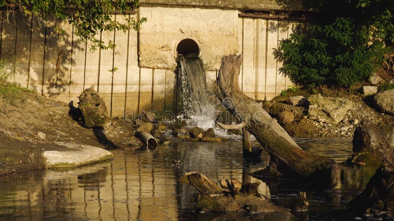 Wastewater from the Sewage Pipe Flows into the River. Foam Floats on ...