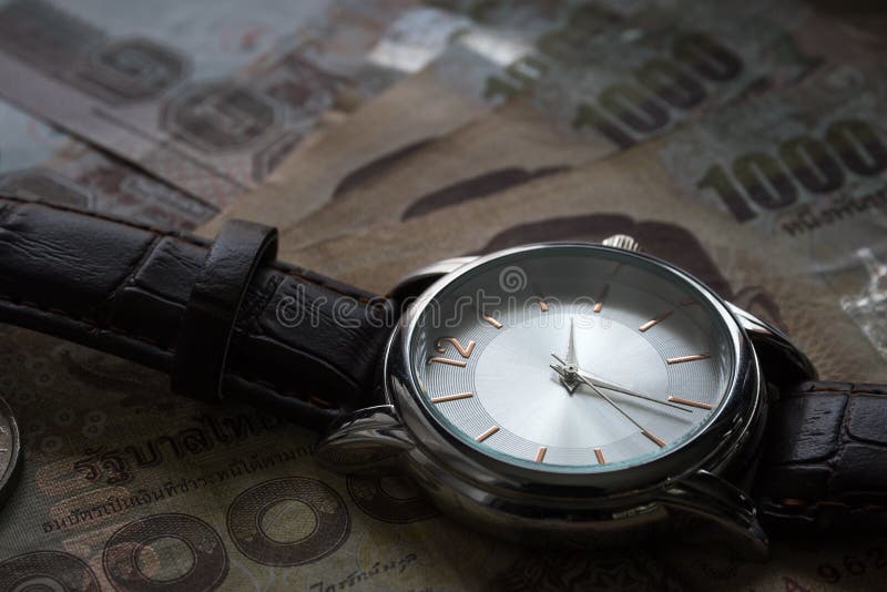 Watch and banknote stock photo. Image of hour, thailand - 86204220