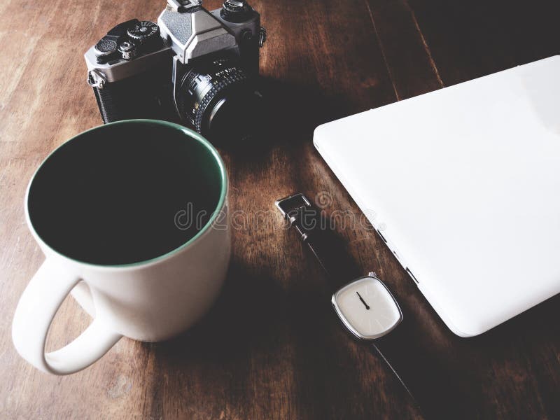 Watch,camera,ceramic,laptop on the Wooden Table Stock Image - Image of ...