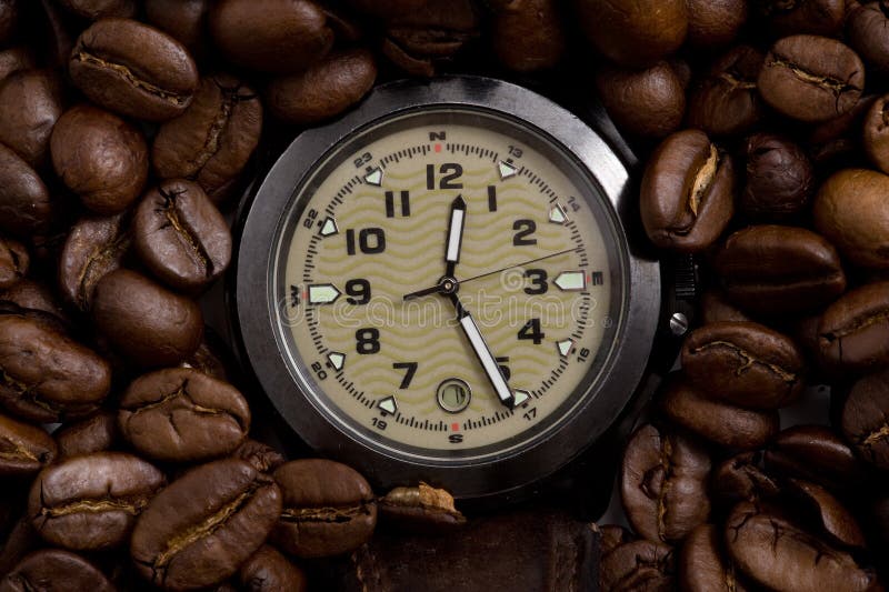 Watch in the coffee beans stock image. Image of energy - 7287371