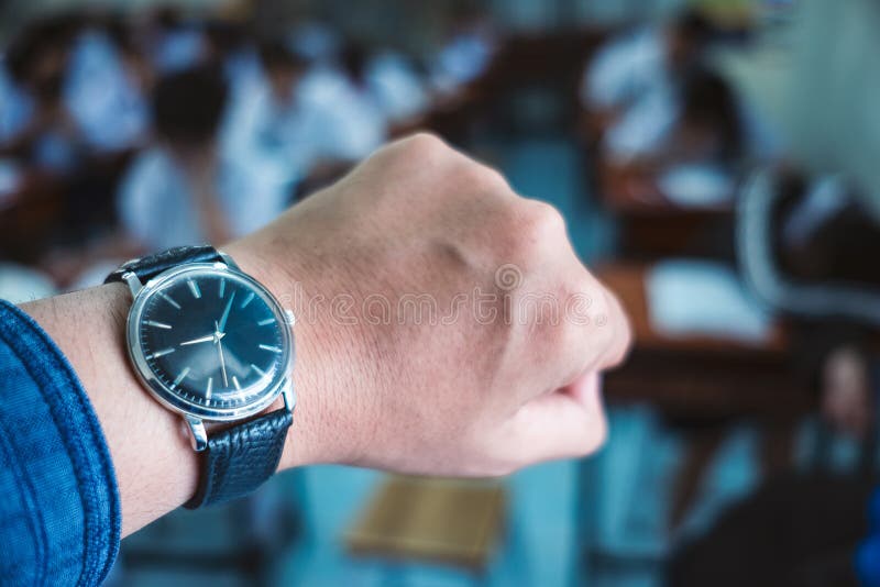 The Watch in Hand of Teacher with Control Student Doing Educational ...