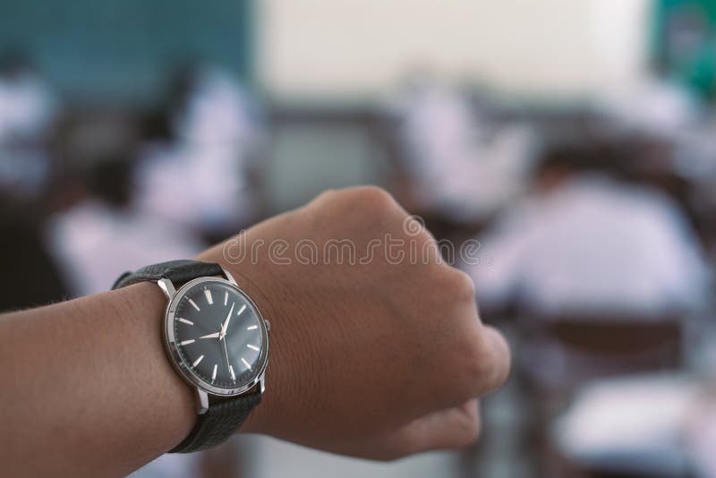 The Watch in Hand of Teacher with Student Doing Educational Exam Test ...