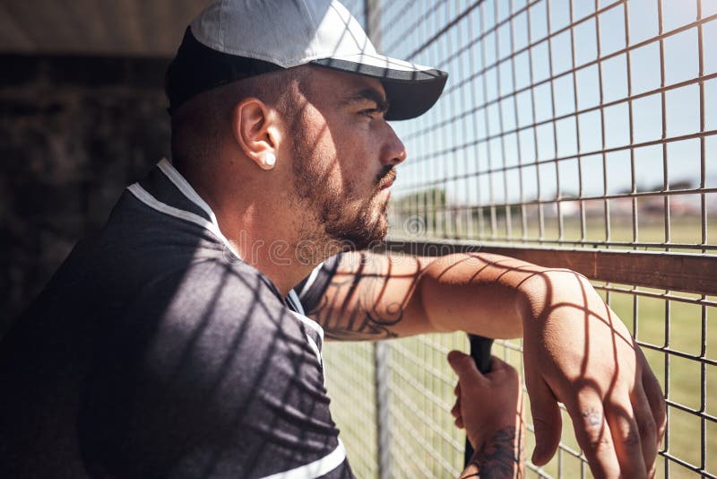 When we Watch, we Learn. a Young Man Watching a Game of Baseball from ...