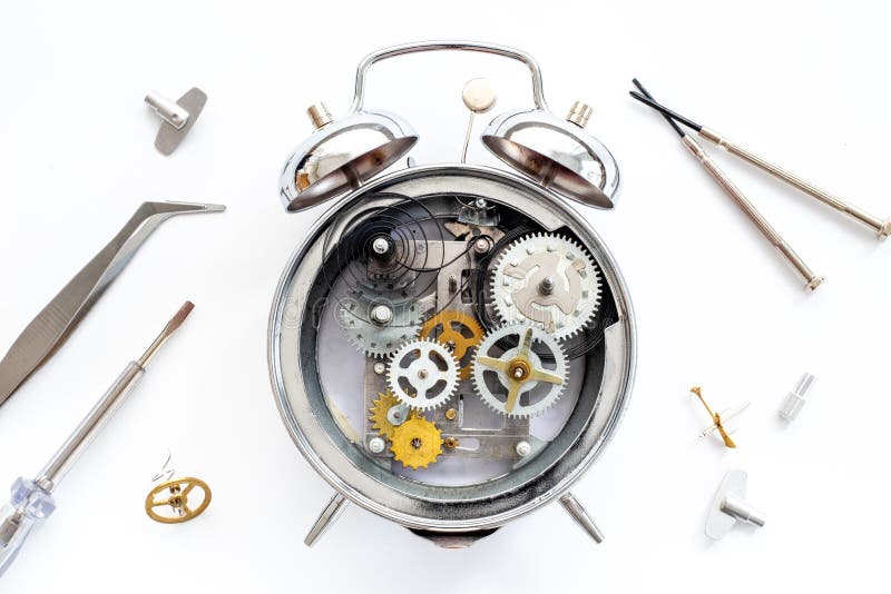 Watch Mechanism and Watchmaker Tools Near Open Alarm Clock Stock Image ...