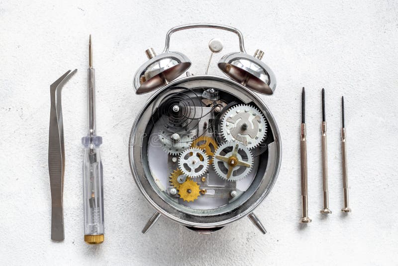 Watch Mechanism and Watchmaker Tools Near Open Alarm Clock Stock Image ...