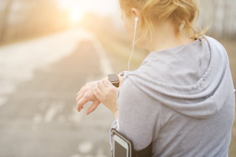 Active Woman Using Smartwatch Stock Photo - Image of equipment, health ...