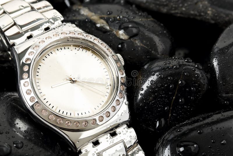 Watch on stones stock photo. Image of chrome, hour, face - 62835522