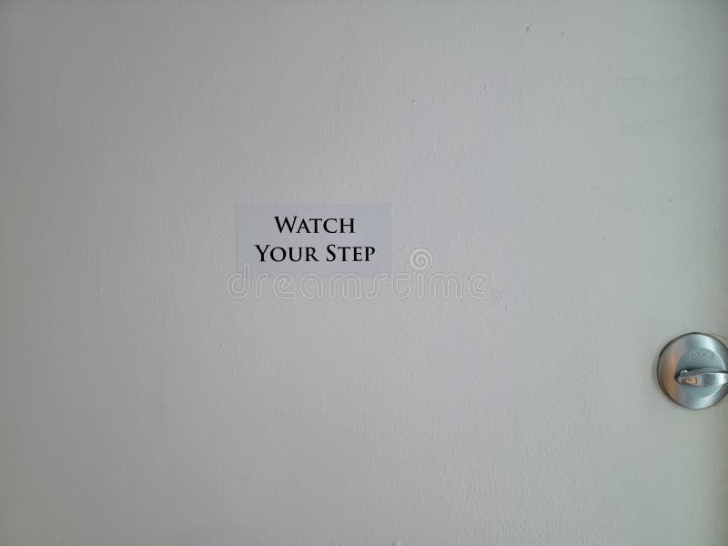 Watch Your Step Sign or Sticker on Locked Door Stock Photo - Image of ...