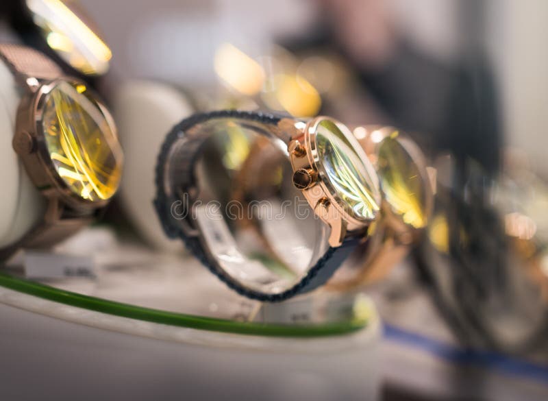 Watches in a luxury store stock photo. Image of labels - 133993718