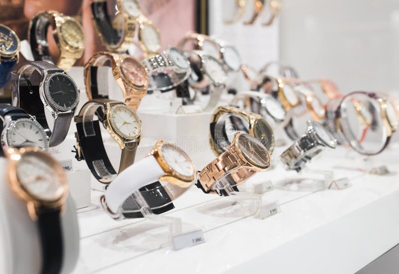 Watches in a luxury store stock photo. Image of sale - 85752866