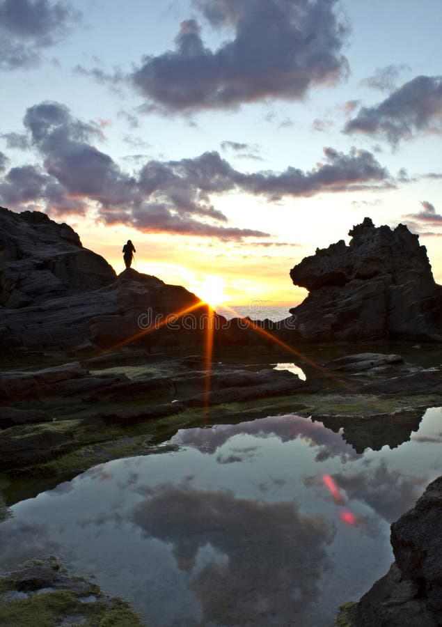 Watching beautiful sunset stock image. Image of rock - 27596227