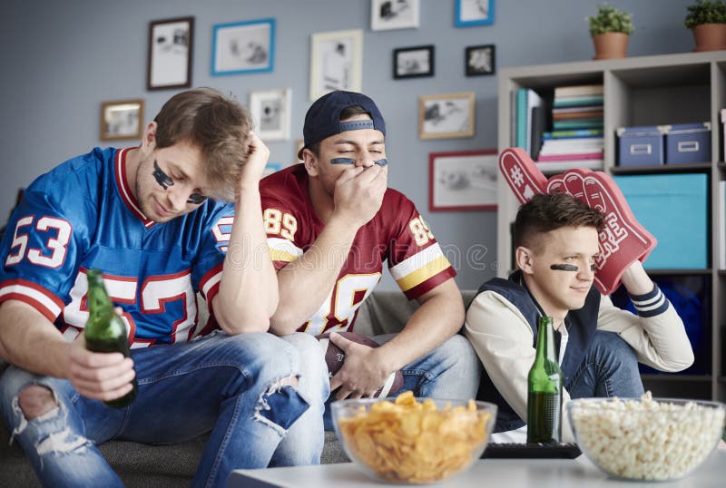 Watching football game stock photo. Image of front, bored - 84894020