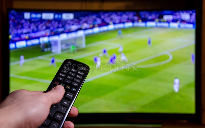 Watching Football on TV and Using Remote Controller Stock Image - Image ...