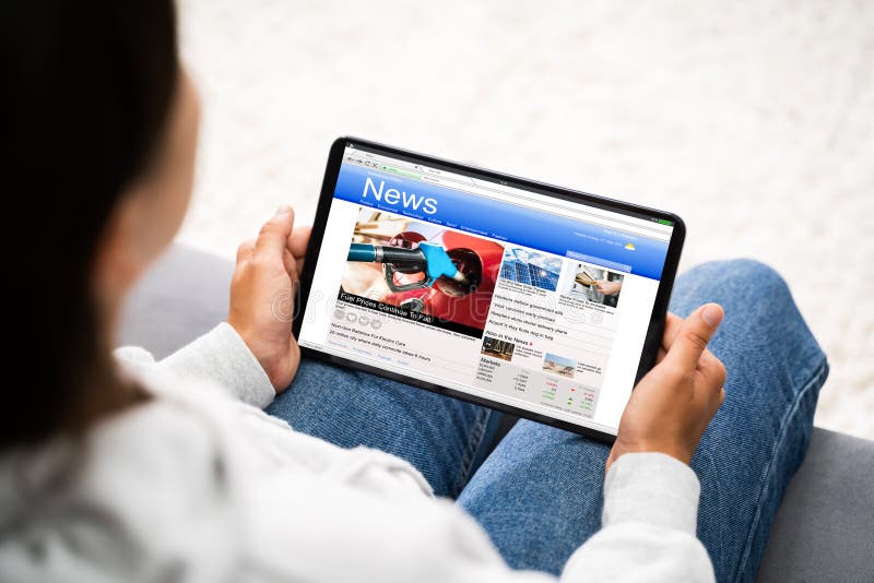 News on Tablet PC stock photo. Image of examining, hand - 21768362