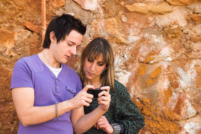 Watching the phone stock image. Image of smartphone, standing - 38649791