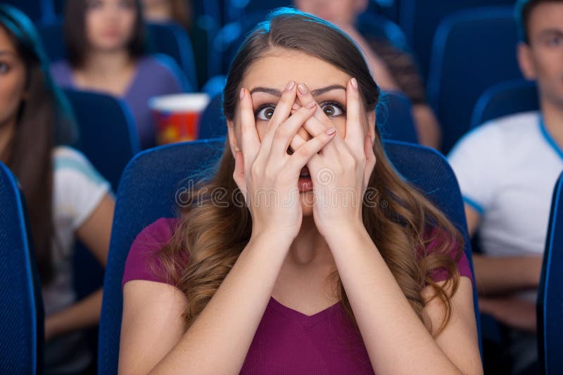 Watching a scary movie. stock image. Image of group, entertainment ...