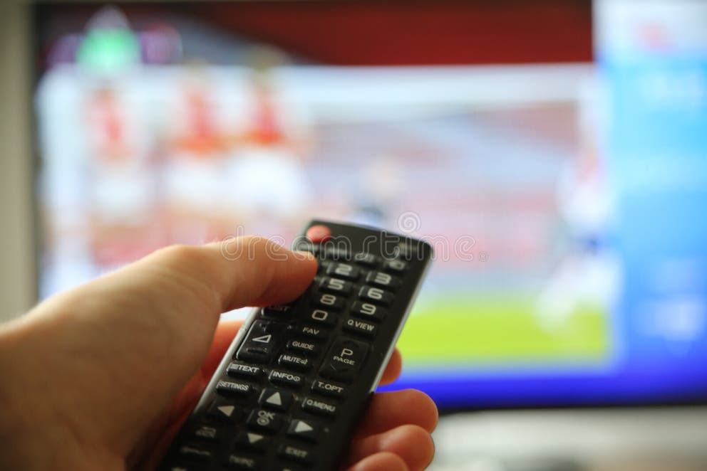 Watching soccer on tv stock photo. Image of soccer, remote - 213343090