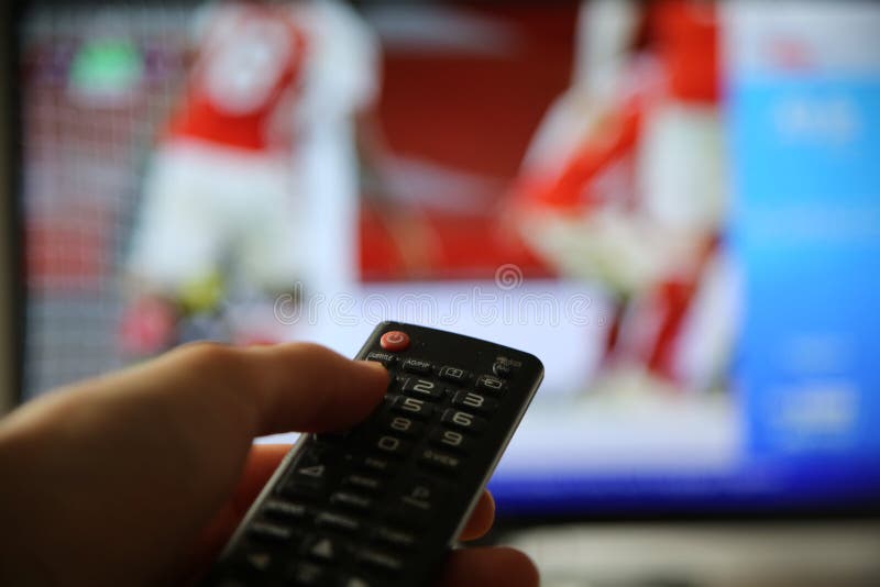 Watching soccer on tv stock image. Image of hand, soccer - 213343161
