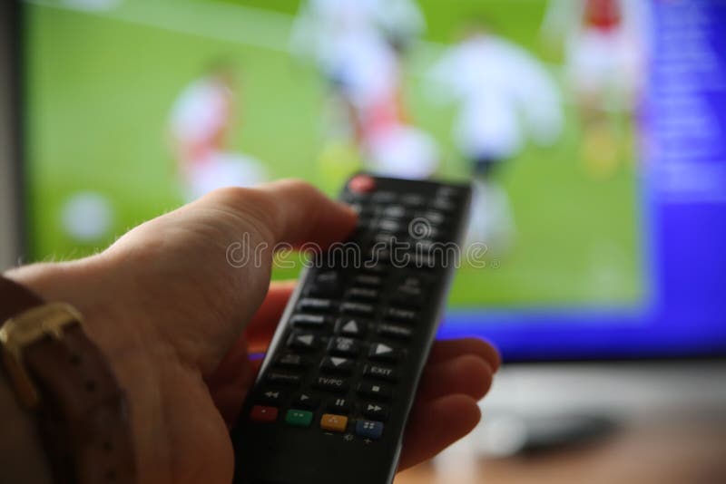 Watching Soccer Tv Using Remote Control Stock Photos - Free & Royalty ...