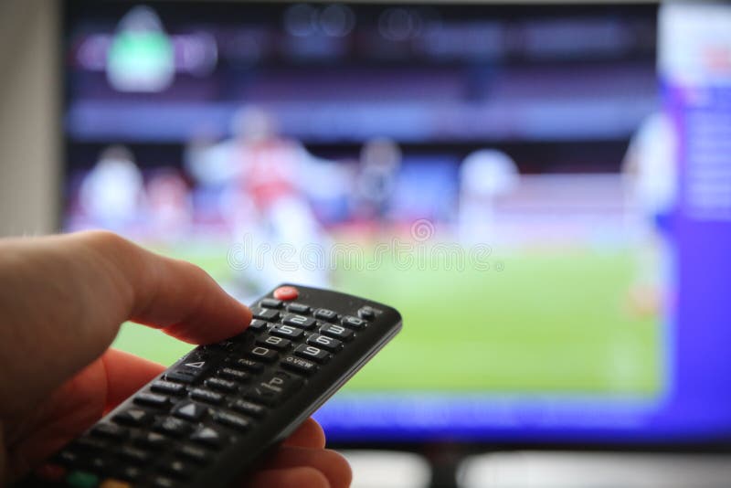 Watching soccer on tv stock image. Image of laptop, home - 213343529
