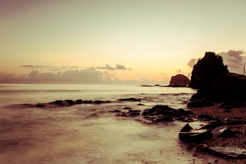 Watching Sunrise and Rock Formation at the Shore Stock Image - Image of ...
