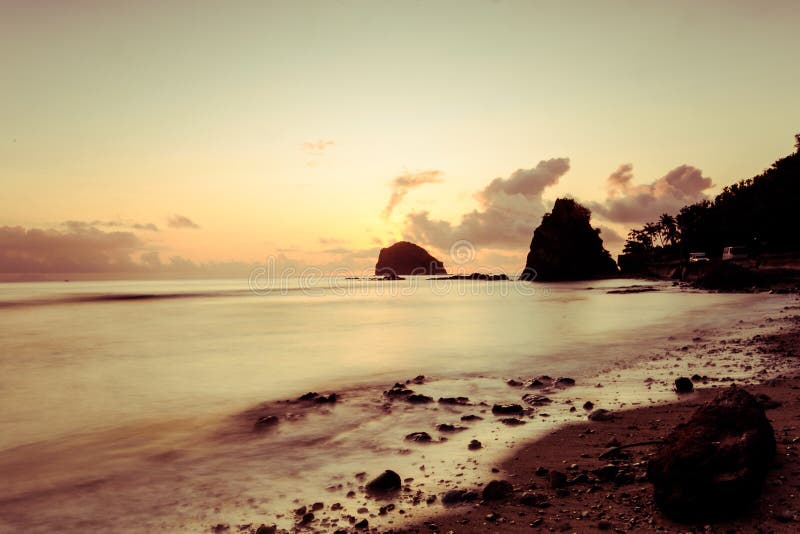 Watching Sunrise and Rock Formation at the Shore Stock Image - Image of ...