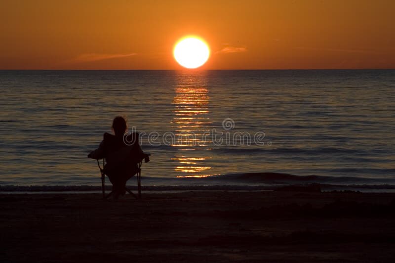 Watching the sunset stock photo. Image of woman, sitting - 1428220