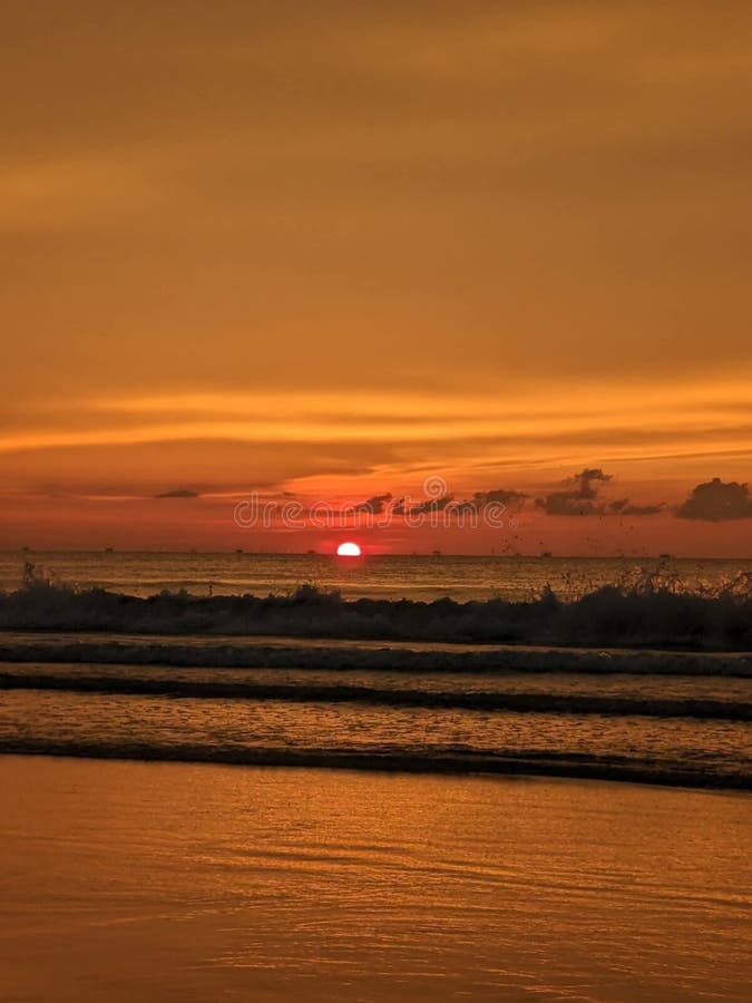 Watching Sunset at the Beach at Dawn Stock Photo - Image of sunlight ...