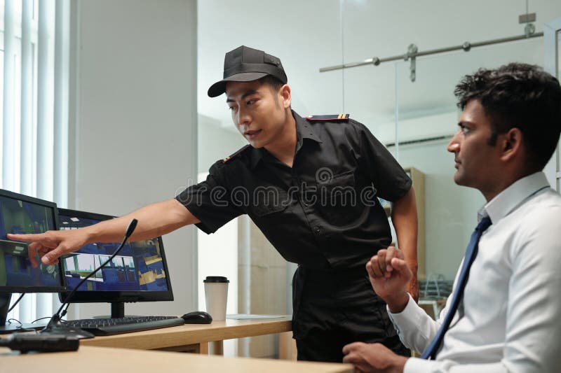 Watching Surveillance Footage with Manager Stock Photo - Image of ...