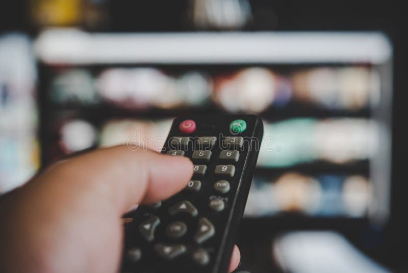 Watching Television, with a Tv Remote Control in the Hand Stock Image ...