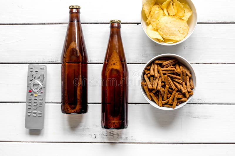 TV Remote Control, Snacks, Beer for Whatchig Film on Wooden Background ...
