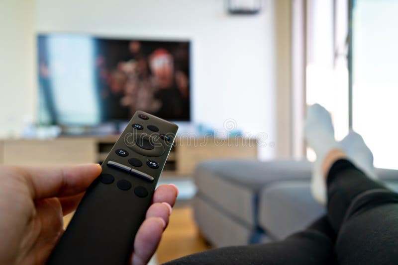 Watching TV, Hand Holding Remote Controller in Front of Big Television ...