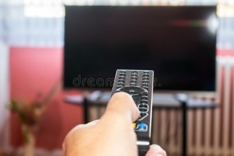 Watching Tv and Using Remote Control Stock Photo - Image of video ...