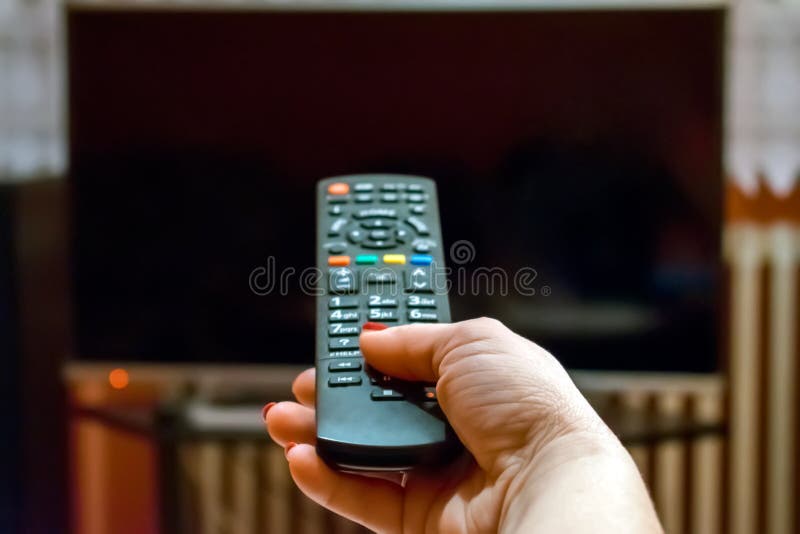 Watching Tv and Using Remote Control Stock Photo - Image of cinema ...