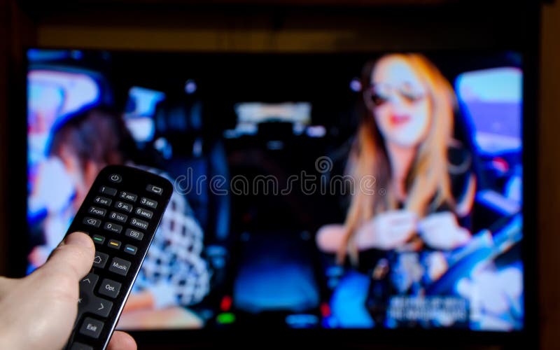 Watching TV and Using Remote Controller Stock Image - Image of ...