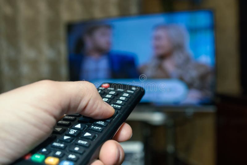 People Switch Channels On TV Using Remote Control Stock Photo - Image ...