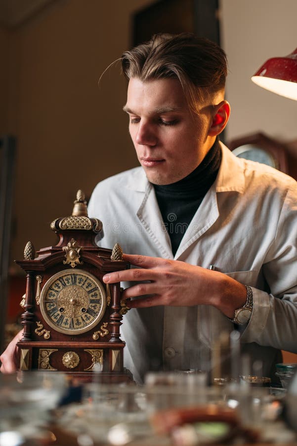 Watchmaker with Old Mechanical Desk Clock Stock Photo - Image of ...